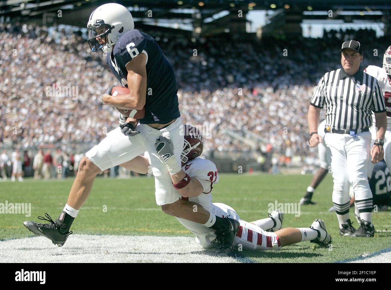 Penn State's Derek Moye drags Temple's Kevin Kroboth into the end zone ...