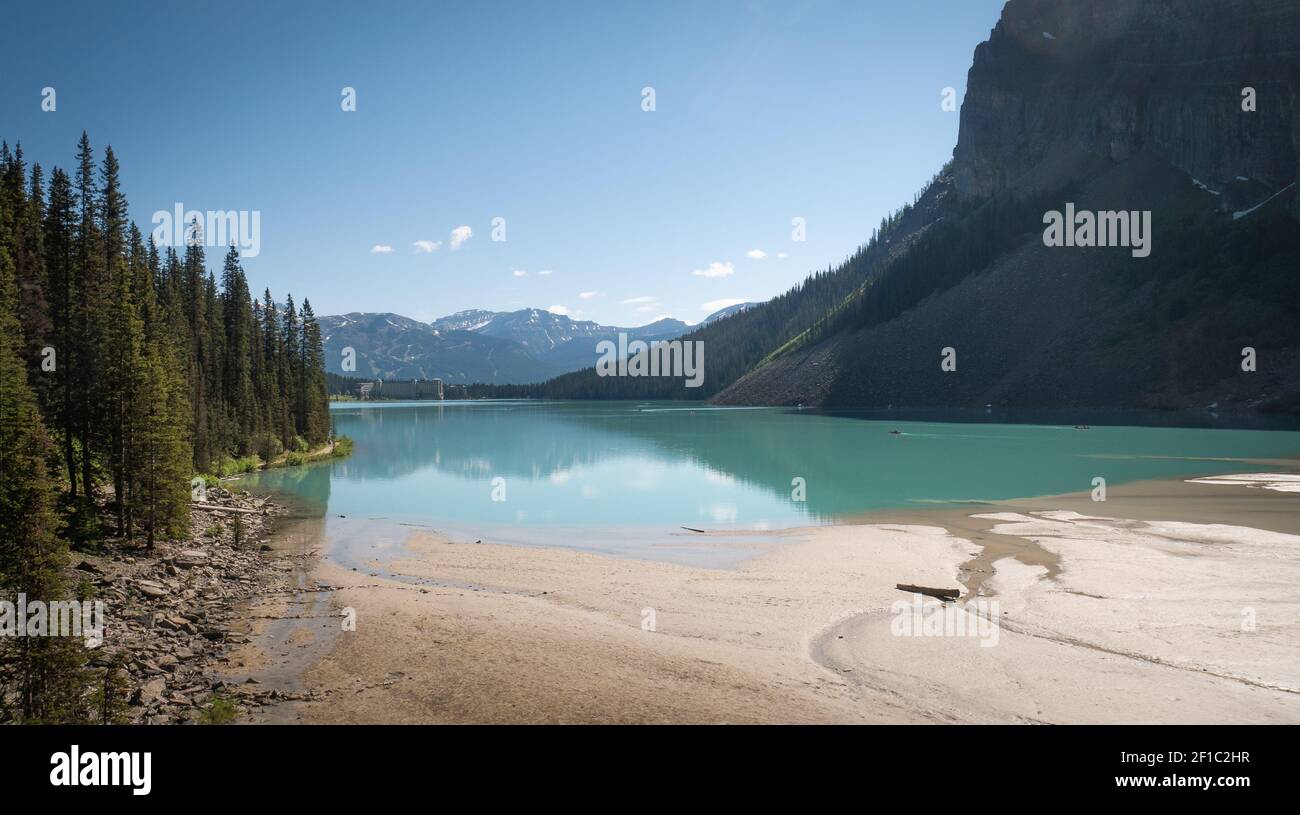 Turquoise glacier lake surrounded by mountains, shot in Lake Louise ...