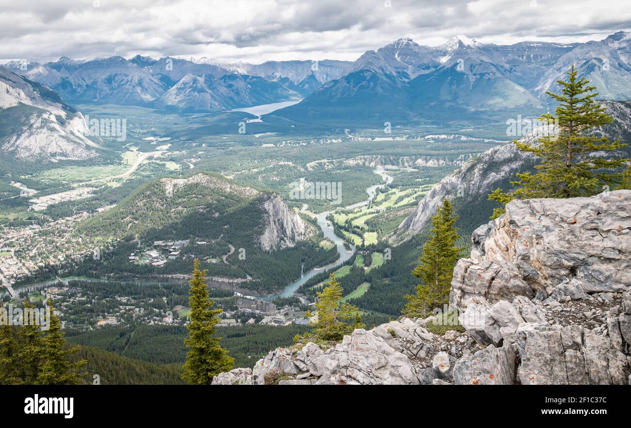 Beautiful alpine valley in Canadian Rockies with trees and rocks in ...