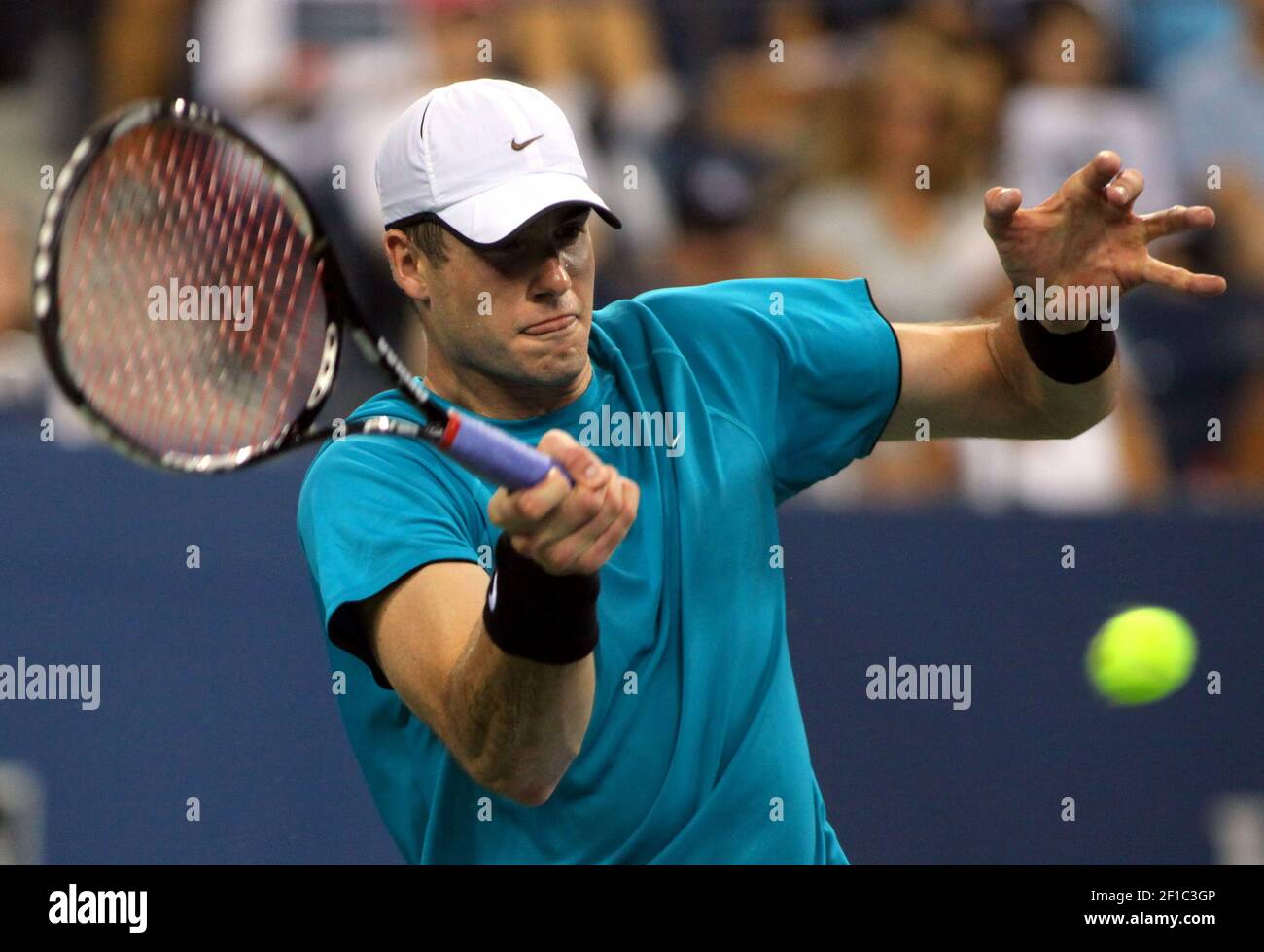 John Isner of the USA returns to Andy Roddick of the USA during the US ...
