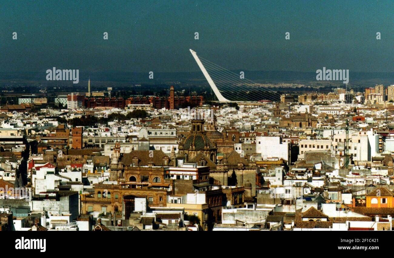 The modern suspension bridge of Seville, Spain rises above the historic ...