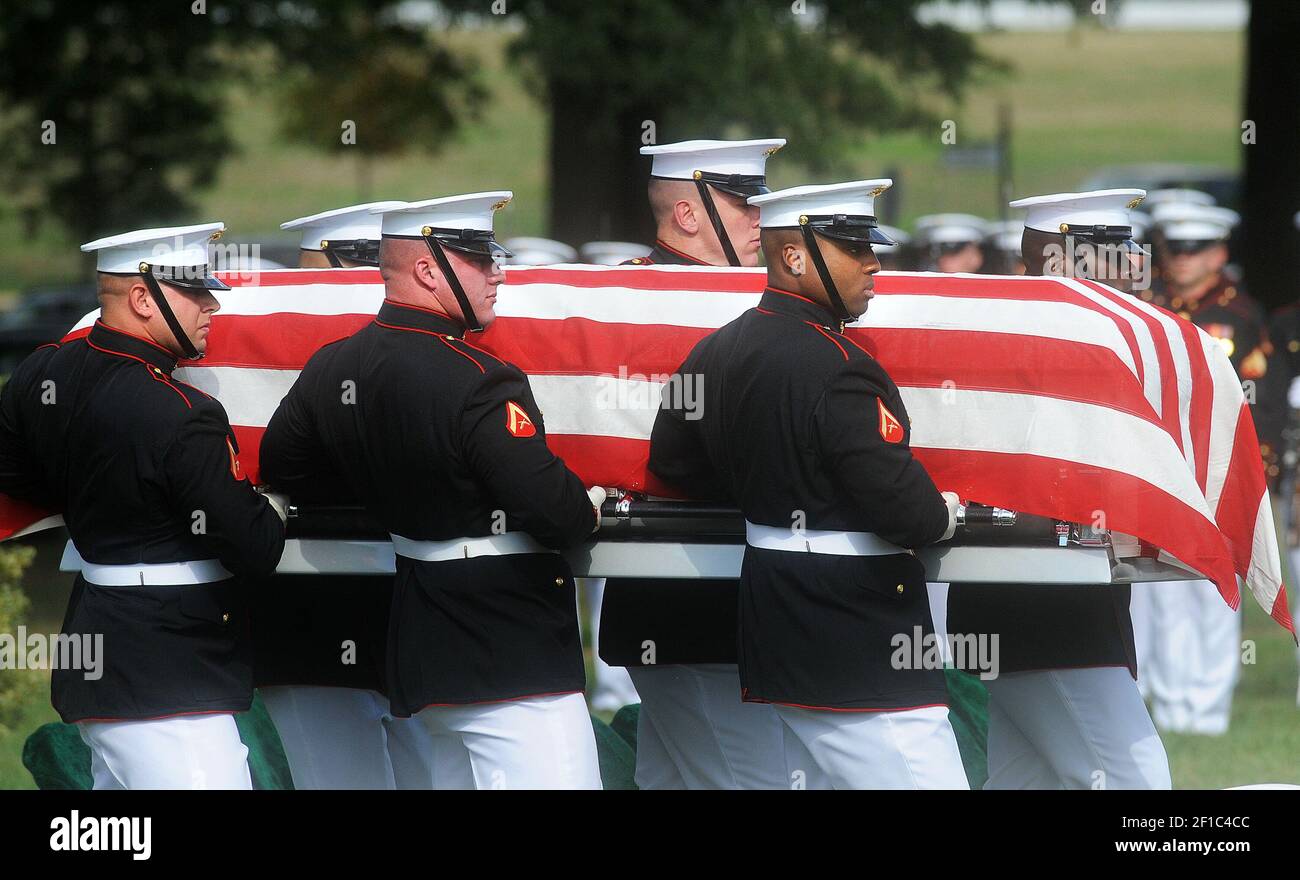 Marine pallbearers carry the casket of Marine Sgt. William Cahir during ...