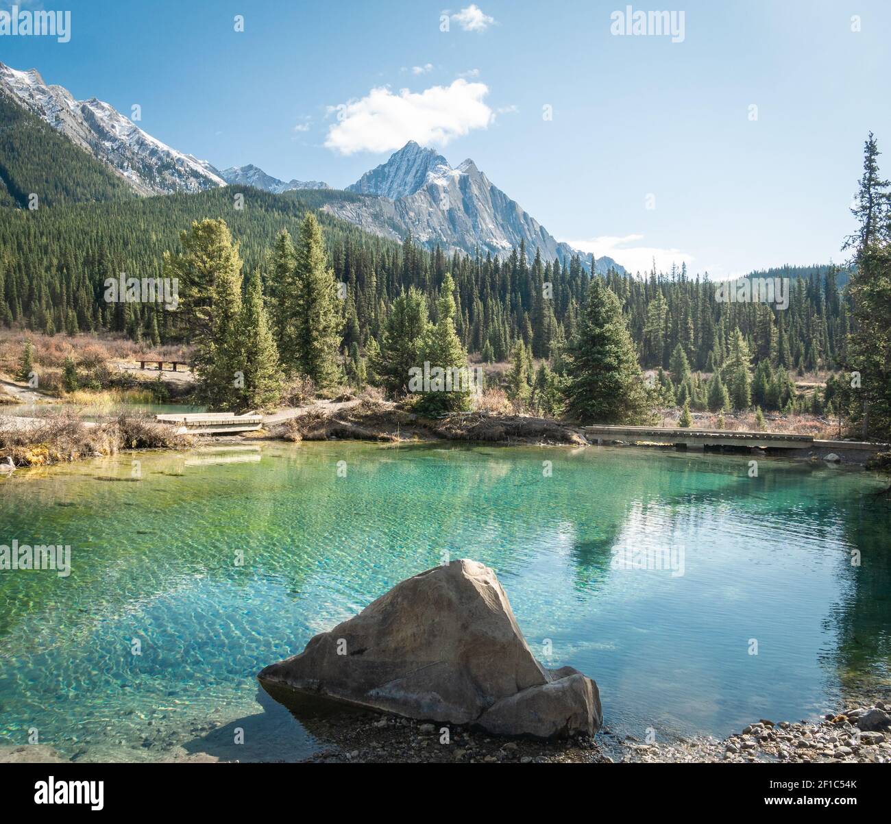 Beautiful alpine scenery with dominant mountain in background and azure ...