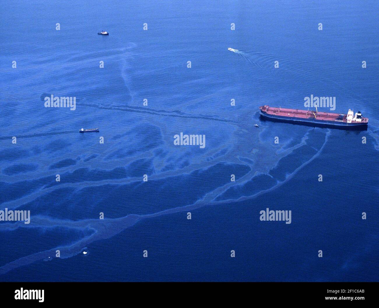 Oil spills from the crippled tanker Exxon Valdez the morning of March ...