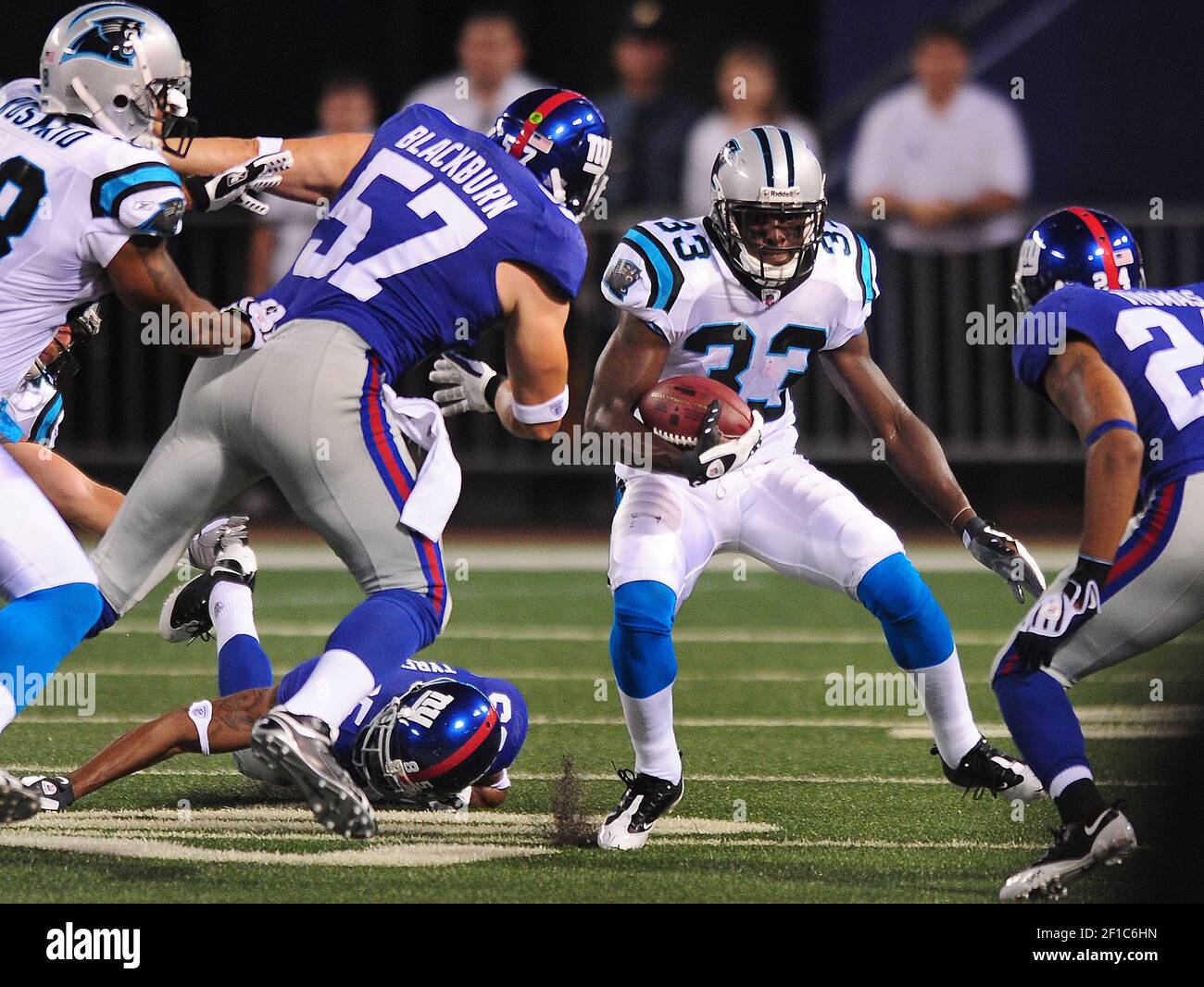 Carolina Panthers running back Mike Goodson (33) looks for a hole on a ...