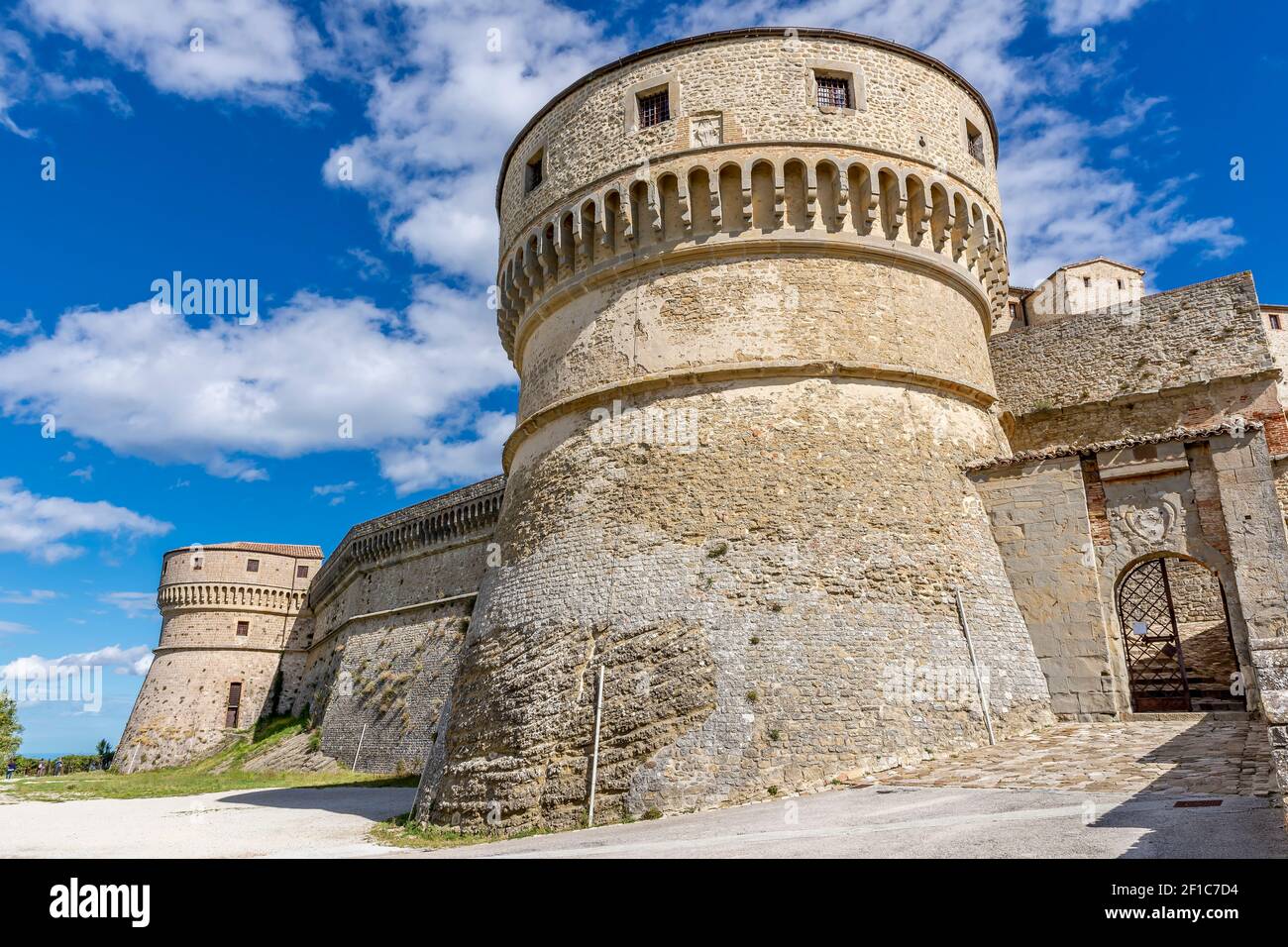 View of the ancient Rocca di San Leo fortress on a sunny day and blue ...