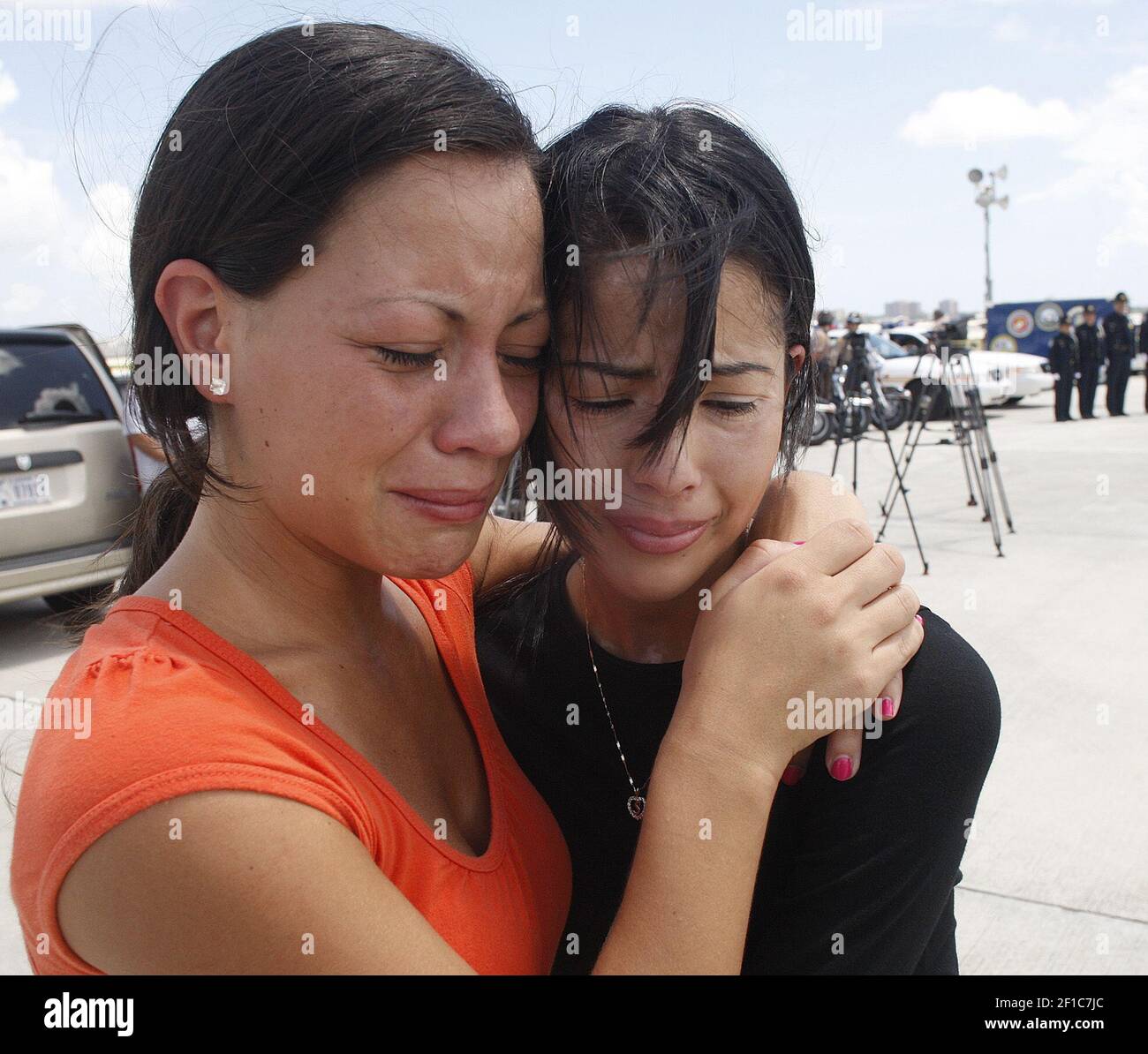 Friends and relatives grieve as the coffin of Corporal Christian Guzman ...