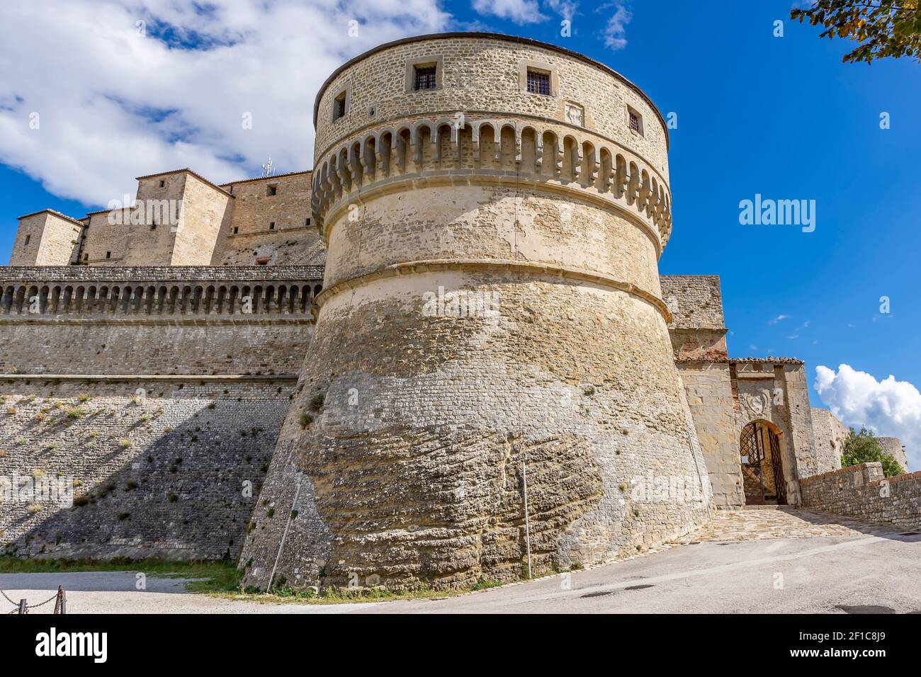 View of the ancient Rocca di San Leo fortress on a sunny day and blue ...