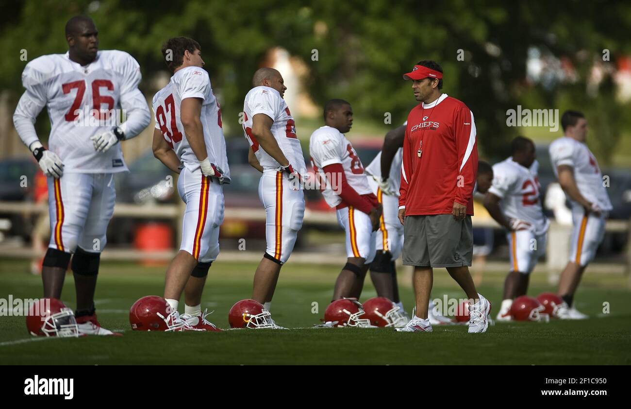 Kansas City Chiefs head coach Todd Haley walks through lines of players ...