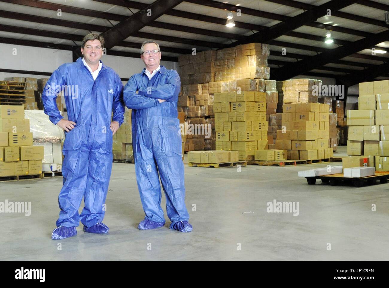 Randy Bennett, left, and Steve Stone model their disposable coveralls ...