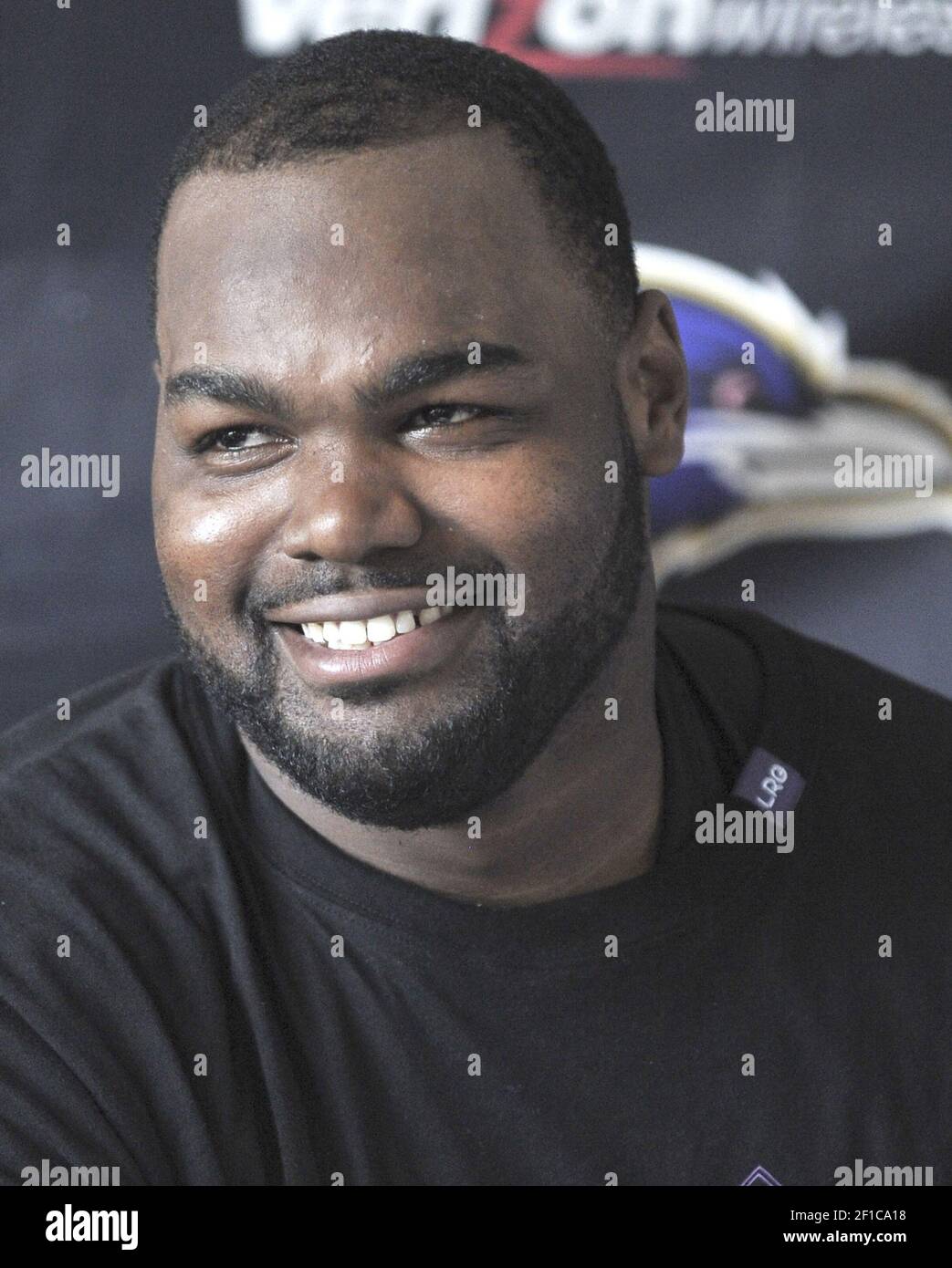 Michael Oher talks to the media after signing a five-year contract with ...