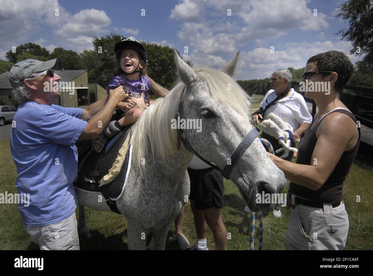 As part of the Mitey Riders program, Lexi, 7, gets to enjoy horseback ...