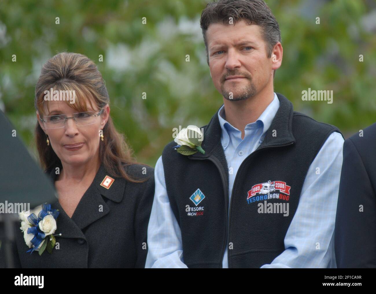 Sarah Palin and her husband Todd look on after she gave a farewell ...