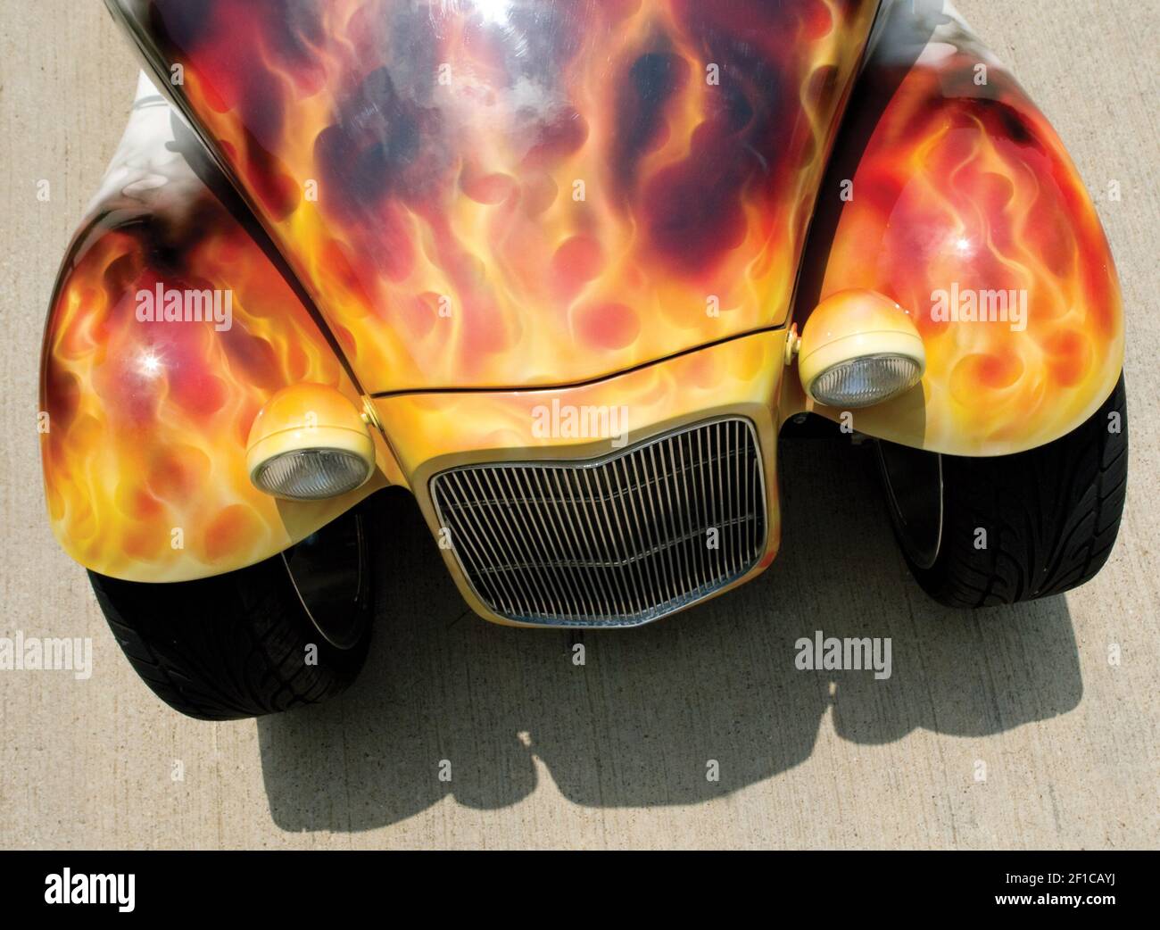 These flames aren't licking the front of a car. That's actually a ...