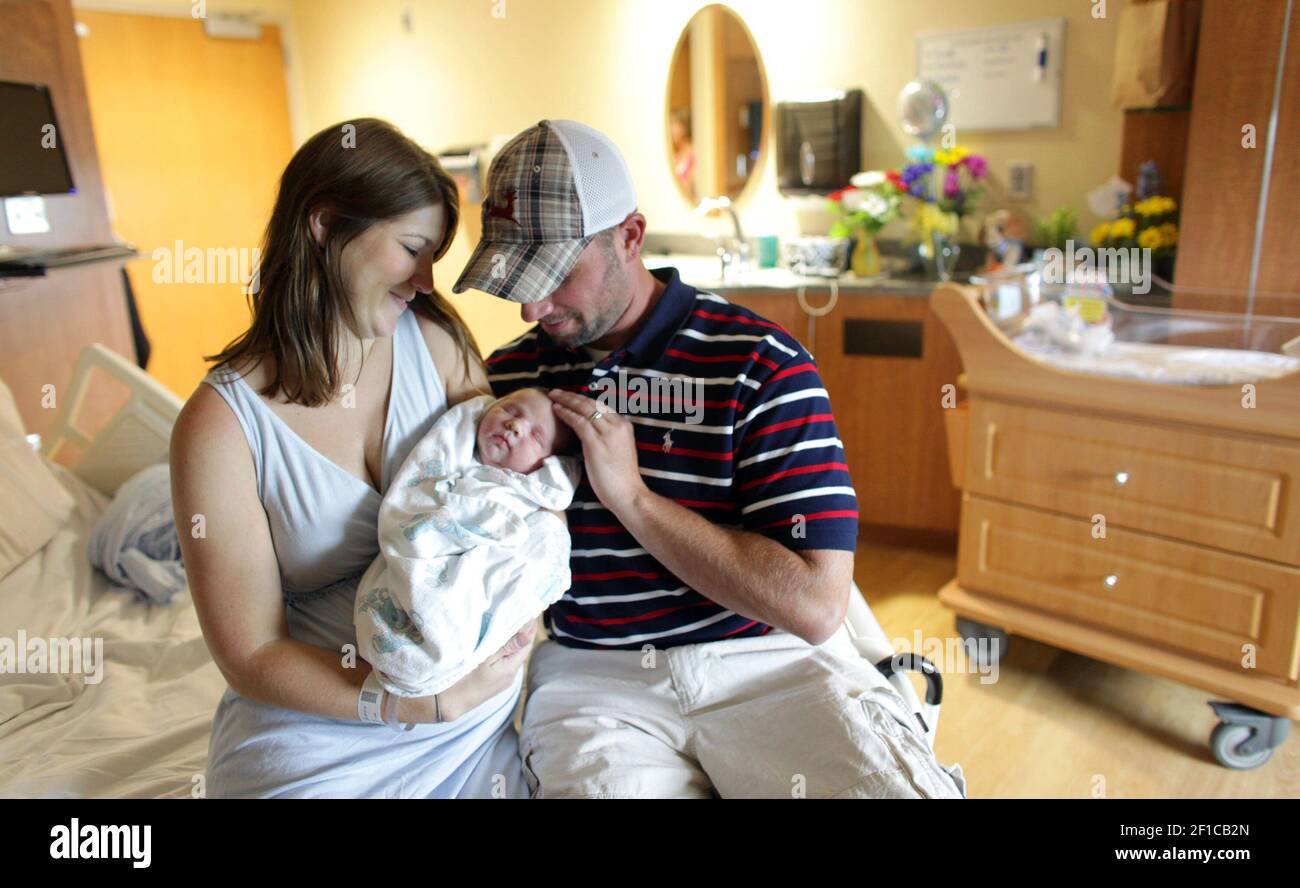 Sonya, left, and Brandon Butorac pose for portrait with their one-day ...
