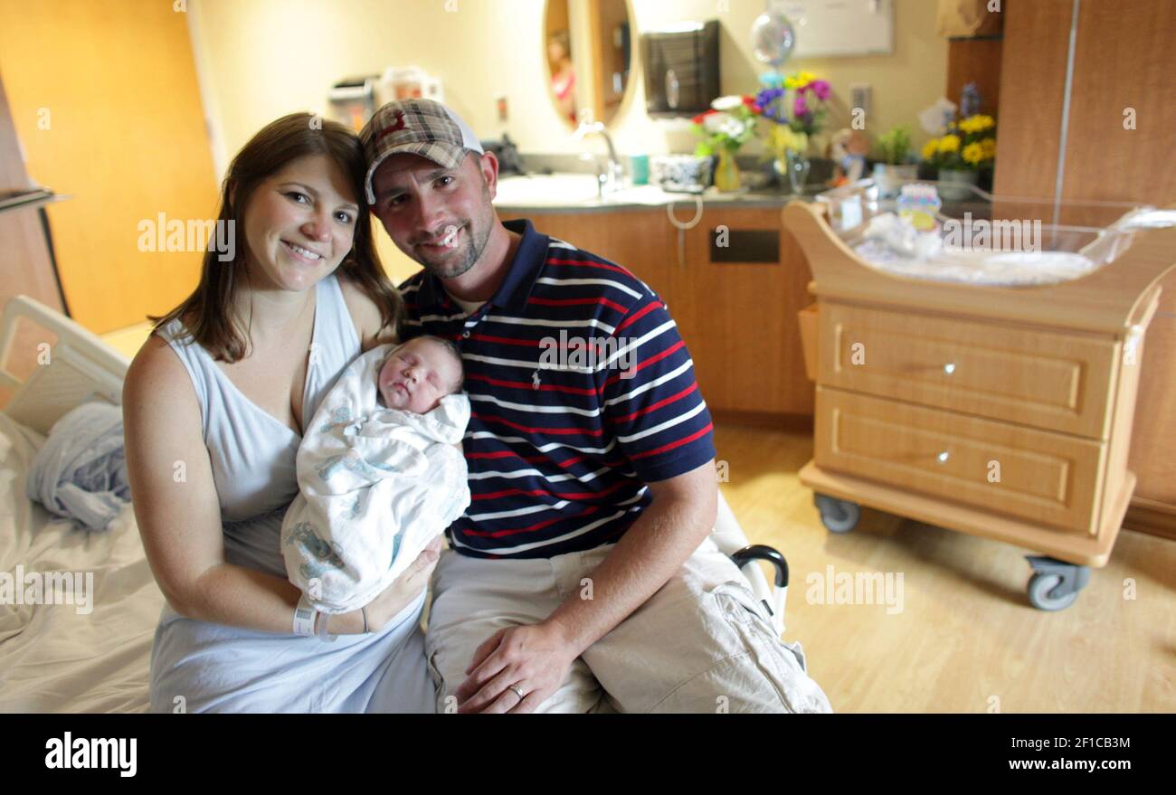 Sonya, left, and Brandon Butorac pose for portrait with their one-day ...
