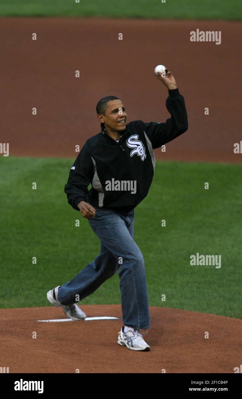President Barack Obama throws out the first pitch during the Major ...
