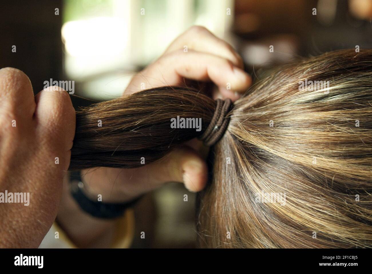 If your hair is making you hot, try a quick and easy hairstyle. First ...