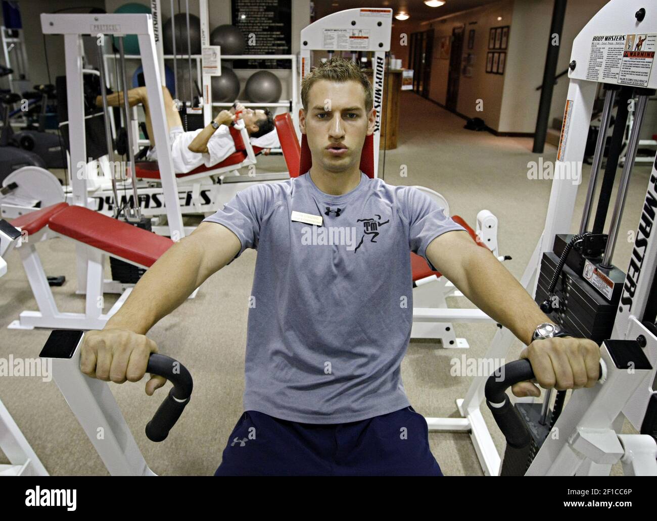 John Standard, a personal trainer at T Bar M Racquet Club, demonstrates ...