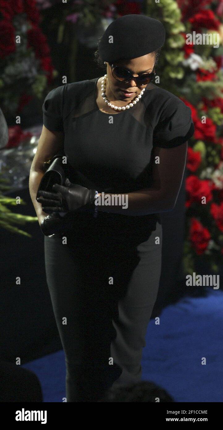 Janet Jackson returns to her seat after greeting Usher during the ...
