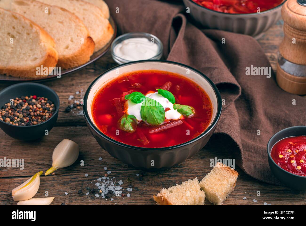 Traditional Russian borscht with beetroot on a background of garlic ...