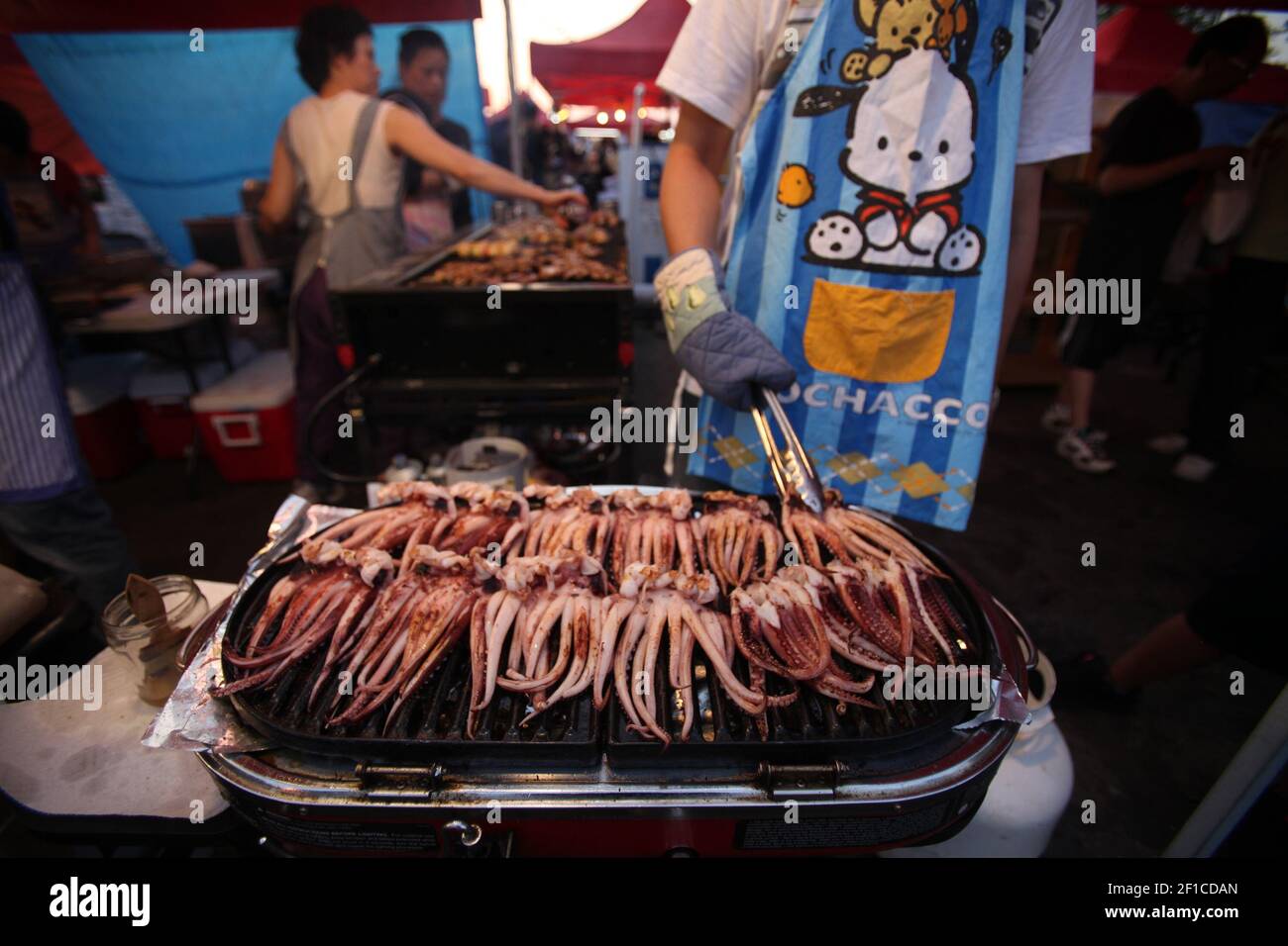 Grilled squid tentacles are prepared as the sun goes down at Richmond's ...