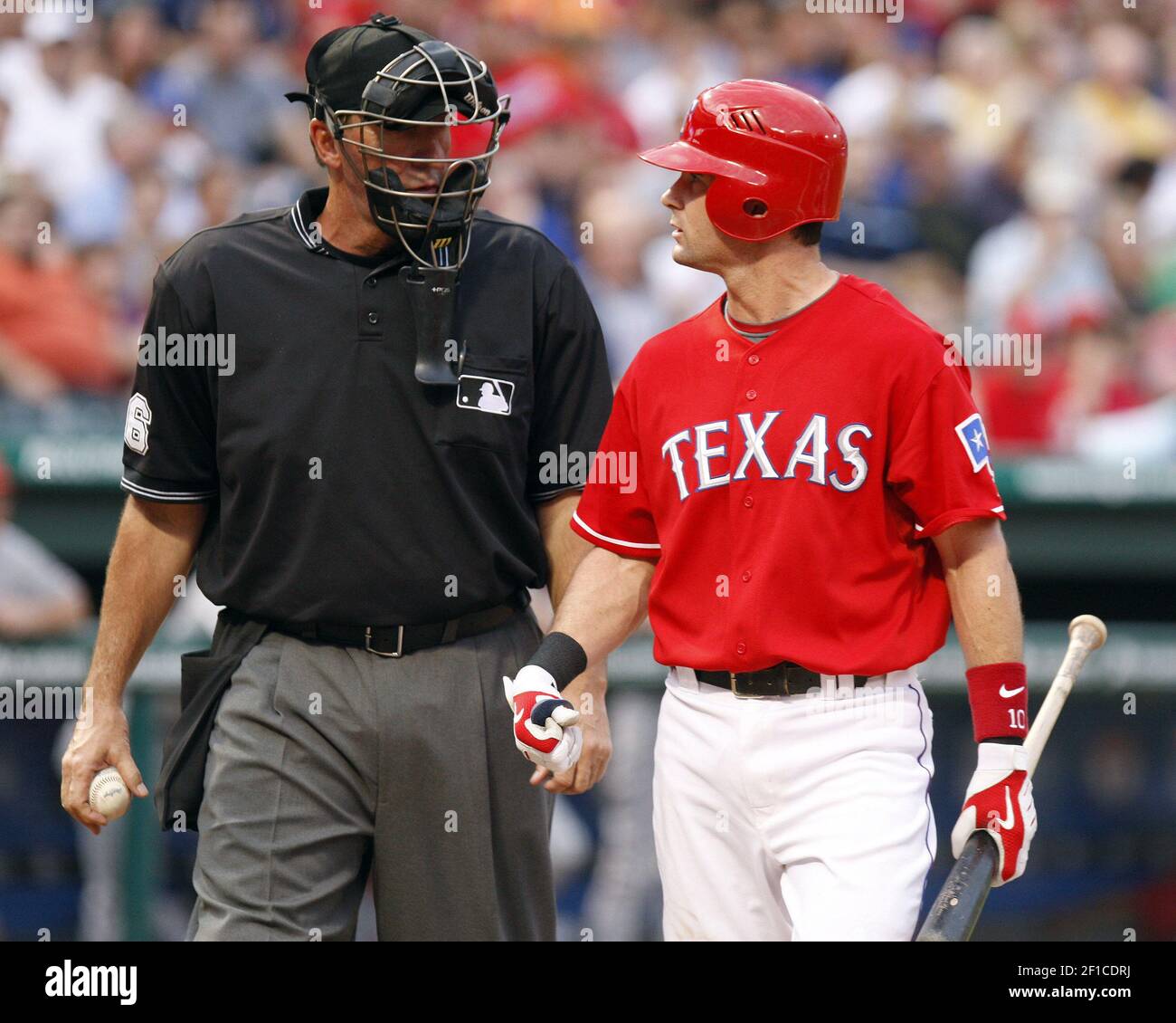 The Texas Rangers' Michael Young disagrees with the call on his third ...