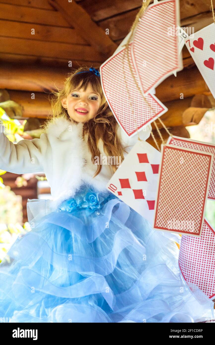 Girl playing cards hi-res stock photography and images - Alamy