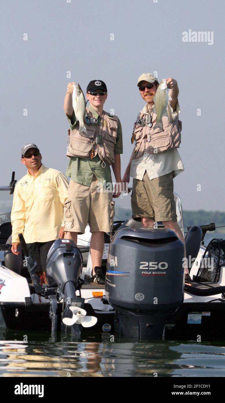 Taylor Turner, left, and his father, Jeff, show wipers caught with ...