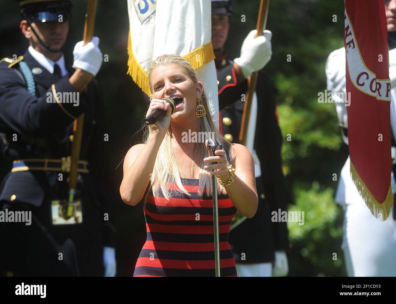 Singer Jessica Simpson performs the National Anthem at the opening ...