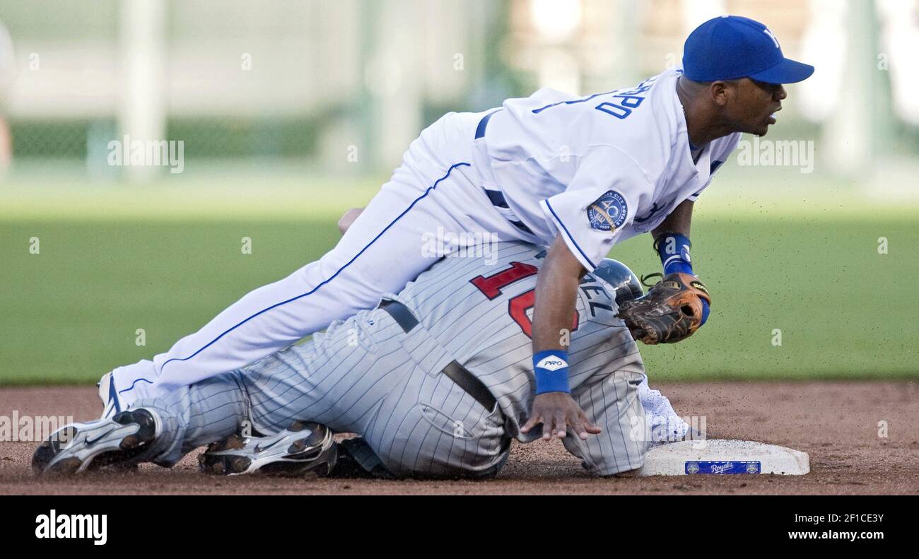 Kansas City Royals second baseman Alberto Callaspo (13) ends up on top ...
