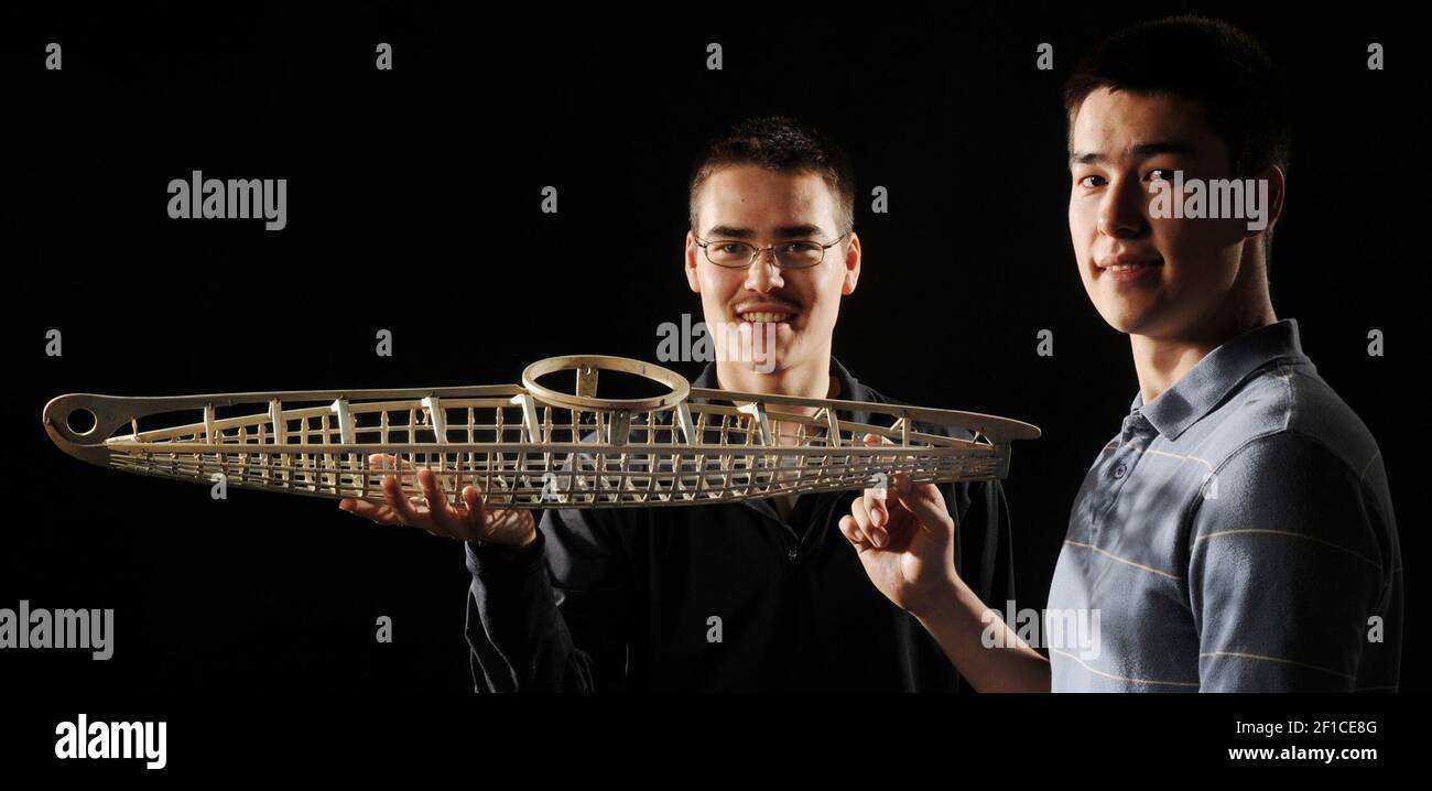Brothers Troy, left, and Ethan Wilkinson hold a three-foot white spruce ...