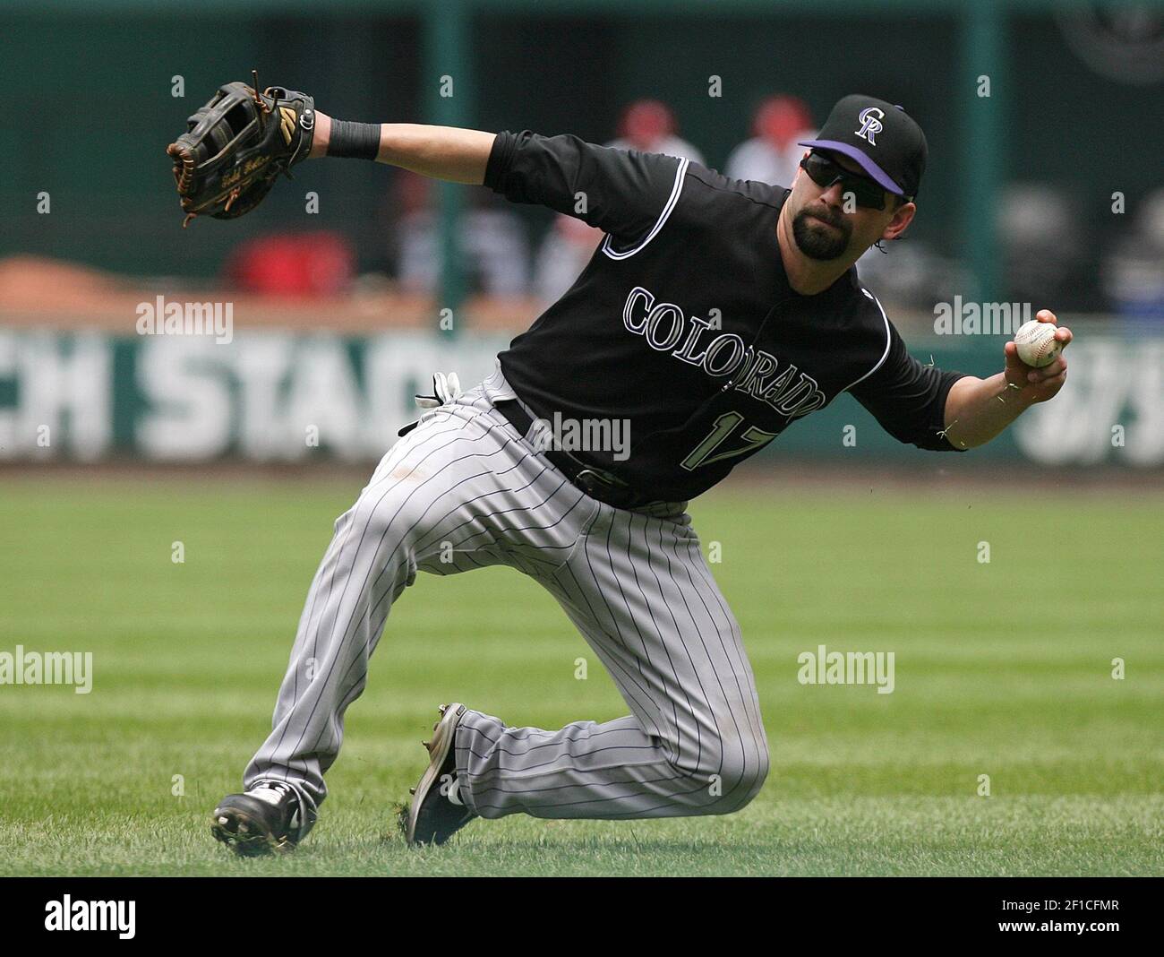 Colorado Rockies first baseman Todd Helton tries to throw to the ...