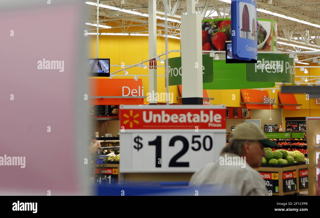 New signage on display at a remodeled Wal-Mart superstore breaks up ...