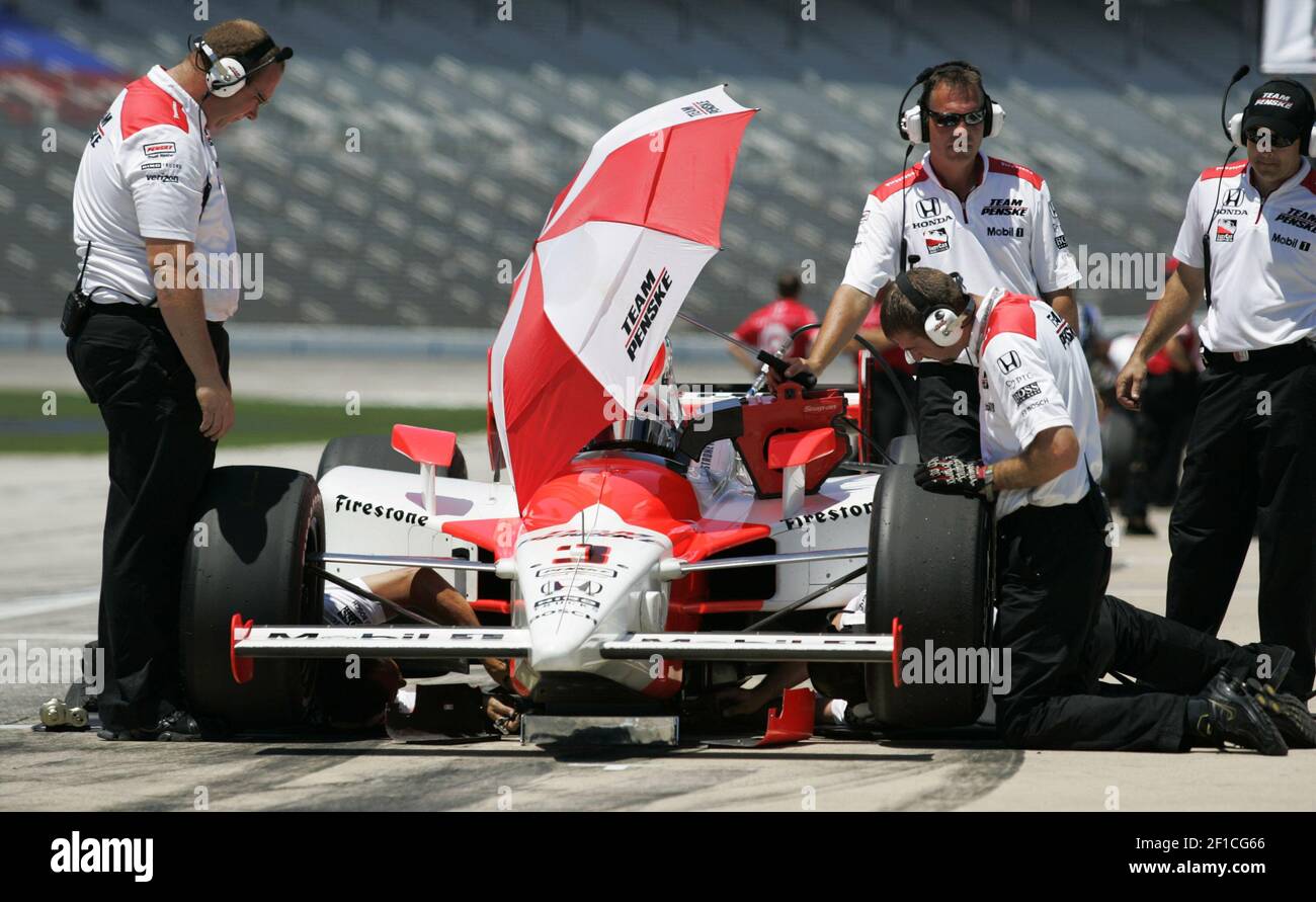 Team Penske driver Helio Castroneves waits in the cockpit of his Indy ...