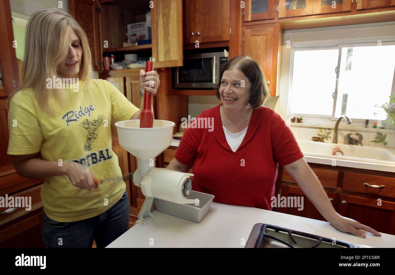 Emily Bohne, 17, left demonstrated a juicer that she has operated from ...