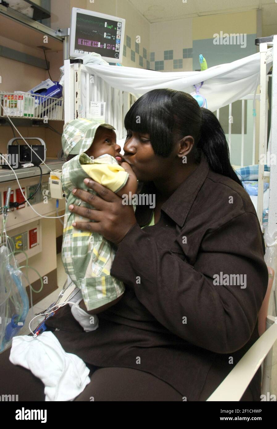 Kimberly Robinson kisses her son Jordan at the Holtz Children's ...