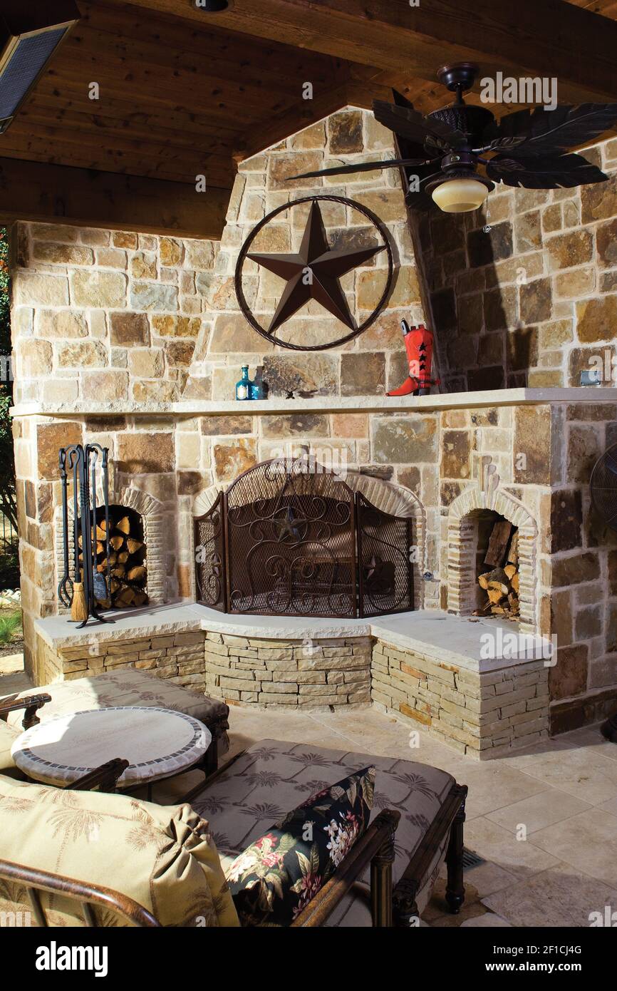 A hand-built limestone fireplace serves as the centerpiece for a 300 ...