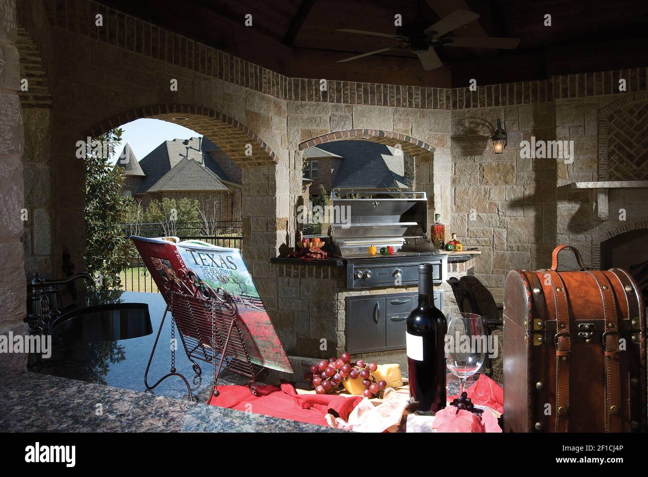 A granite countertop complete with bar area and under-mounted sink are ...