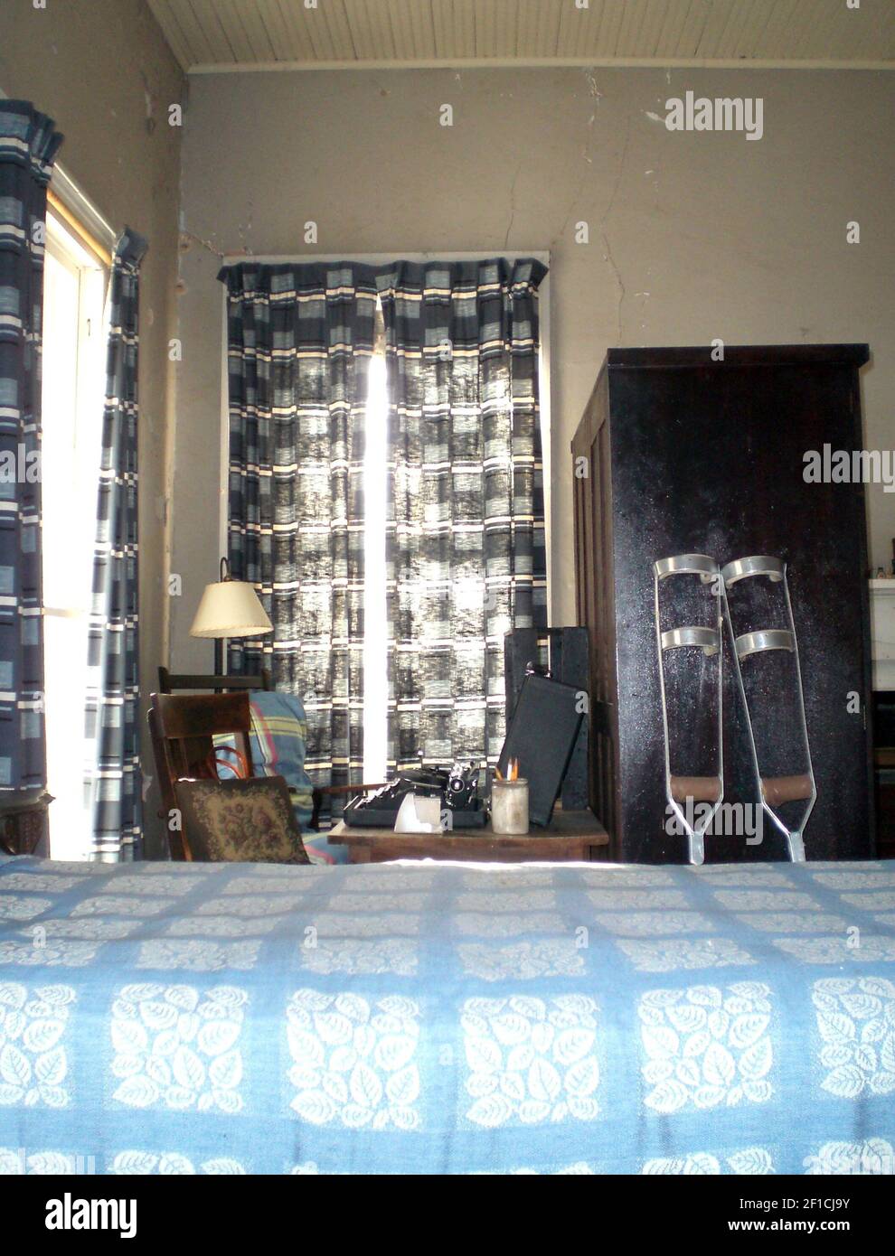 Author Flannery O'Connor's bedroom at Andalusia Farm. The crutches and ...