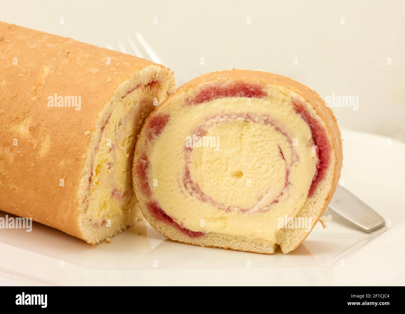 Arctic roll food still-life against plain background, delightful retro ...