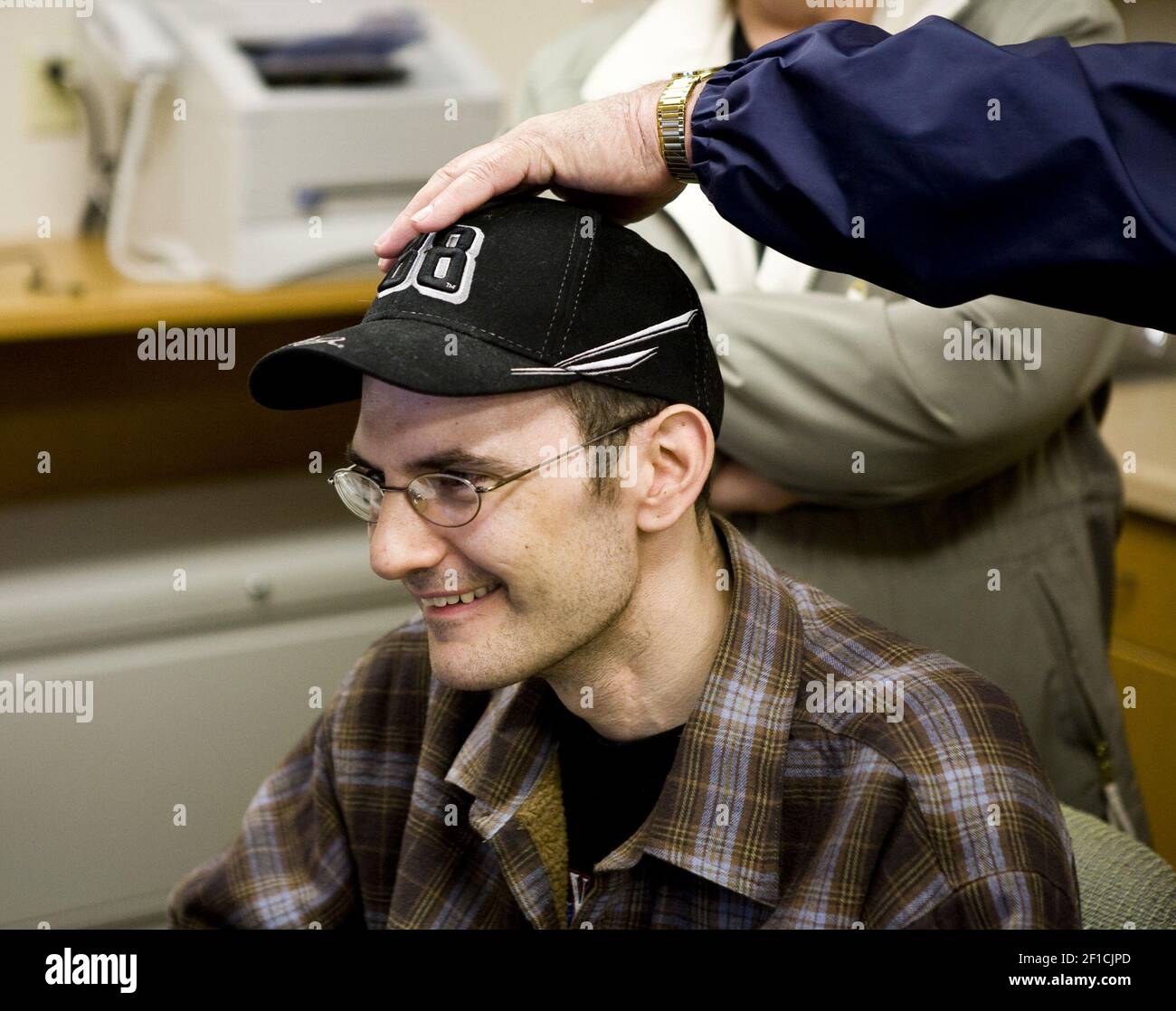 Clint Galster, 34, who has epilepsy, smiles while discussing the ...