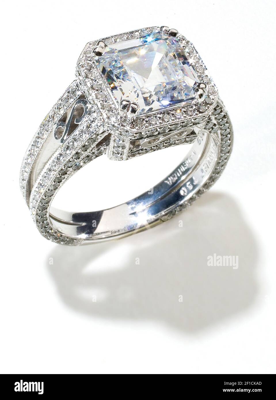 A 2.5-carat Ascher-cut center diamond framed by microbead-set diamonds ...