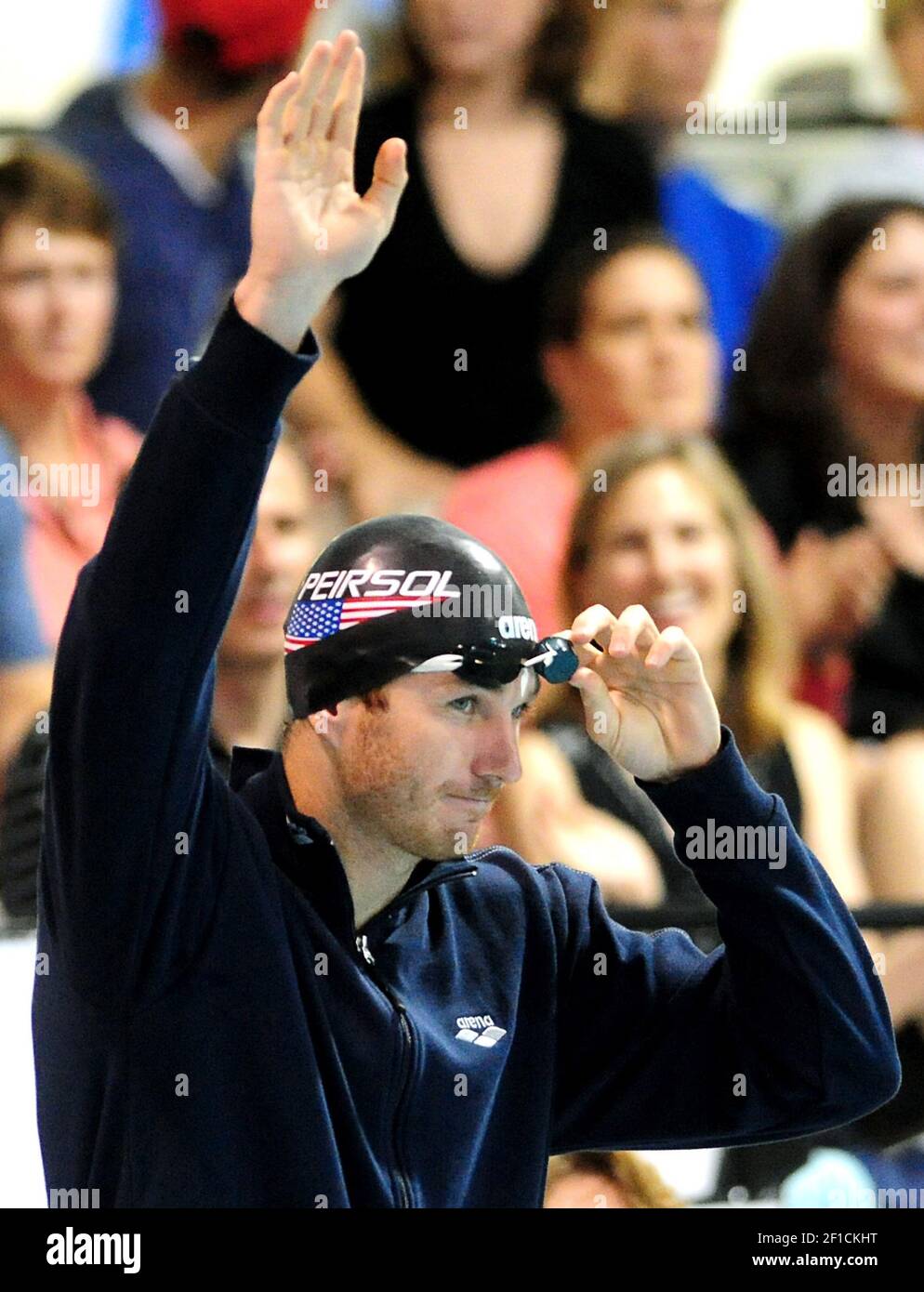 Olympic swimmer Aaron Peirsol waves to the fans prior to the start of ...