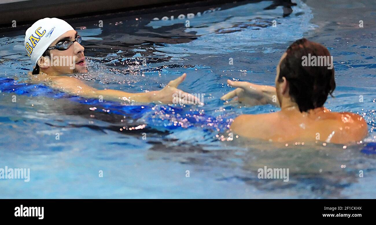 Olympic swimmer Michael Phelps reaches out to shake hands with Aaron ...