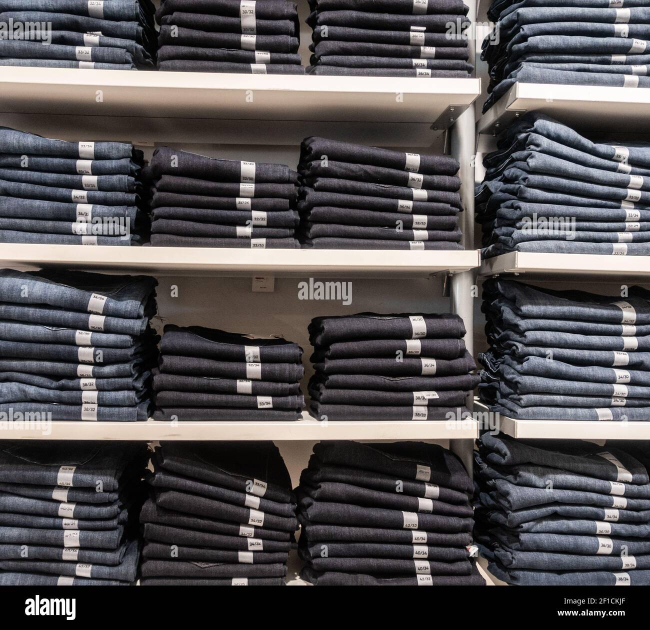 Denim jeans display in clothing store Stock Photo - Alamy