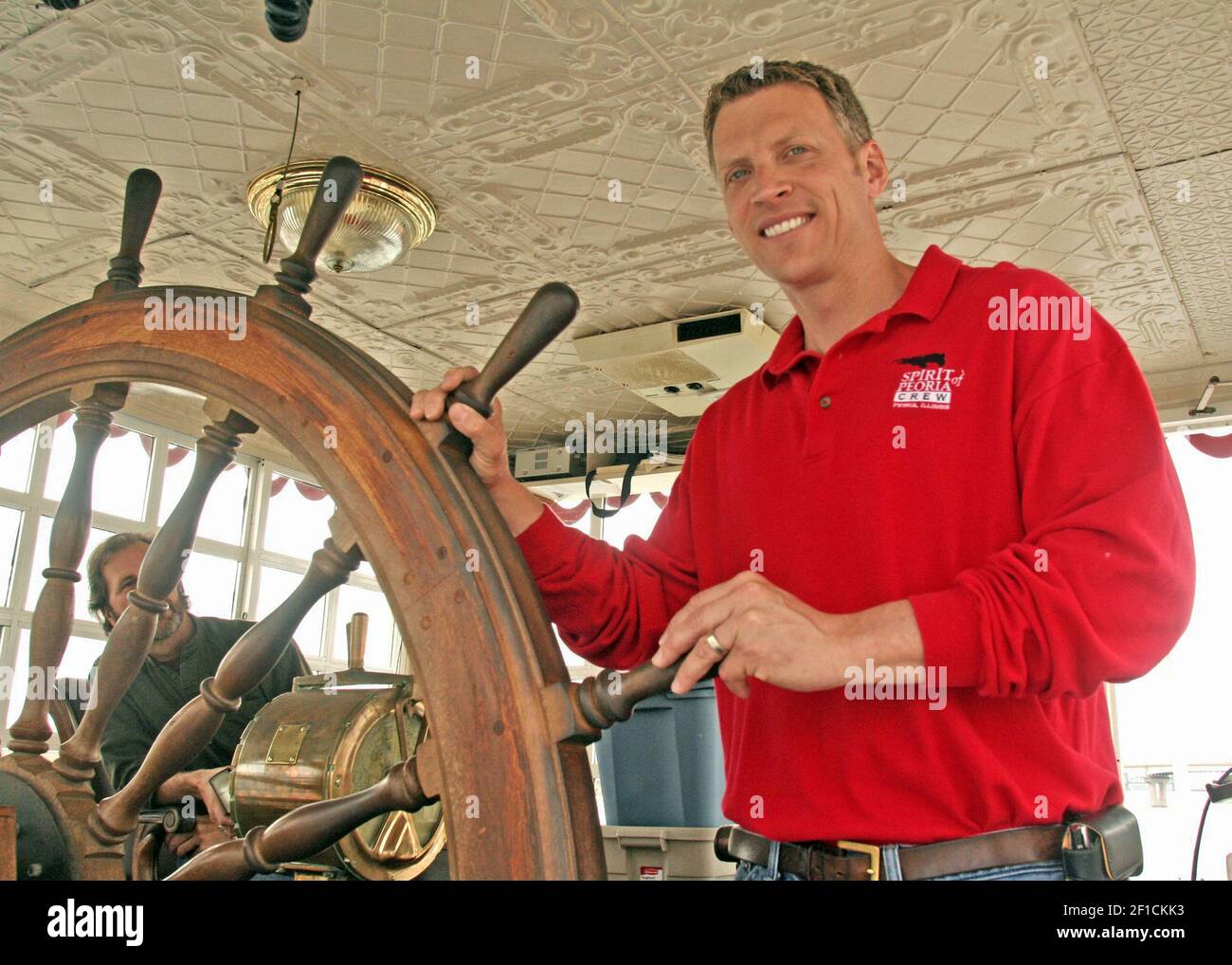 Alex Grieves, owner and captain of the Spirit of Peoria, stands in the ...