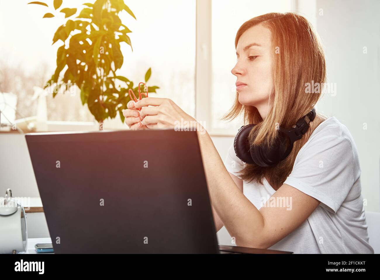 Freelancer woman sitting at workplace and procrastinating. Lazy and ...