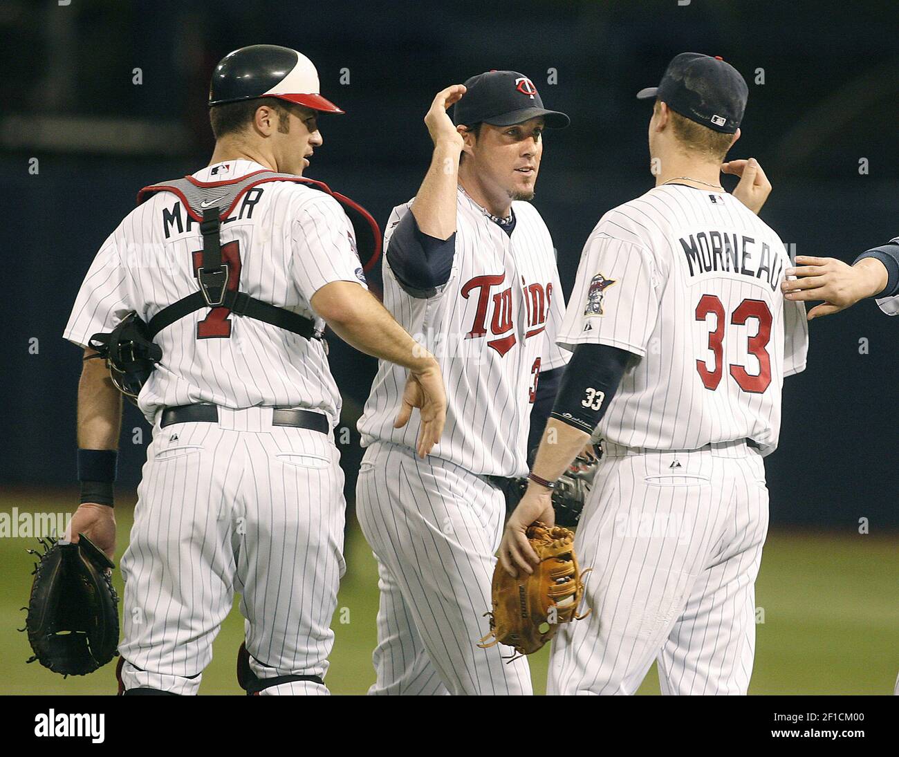 Minnesota Twins catcher Joe Mauer, right, and Justin Morneau ...