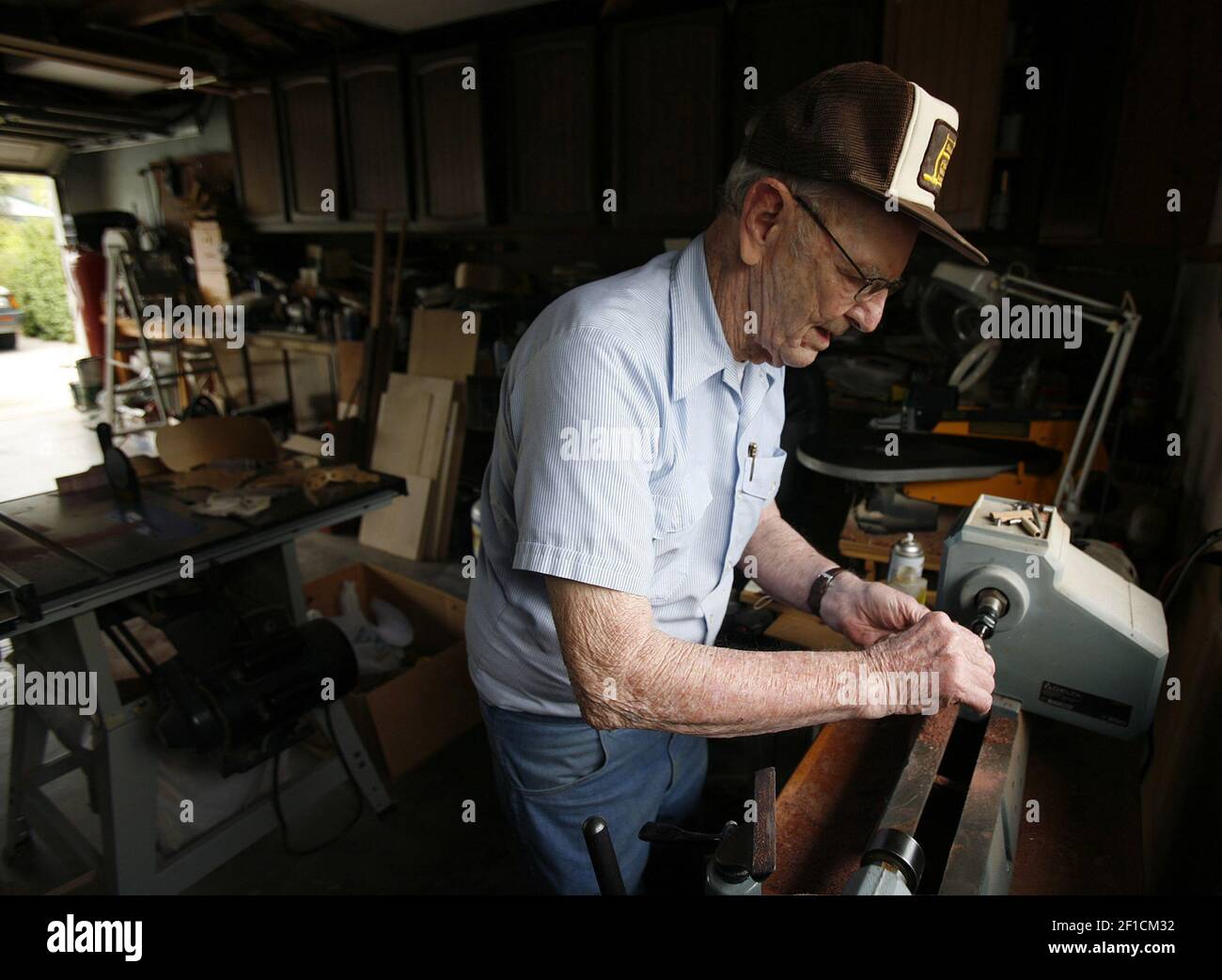 Gene Asbill, 82, uses a wood lathe to create writing pens from wood ...